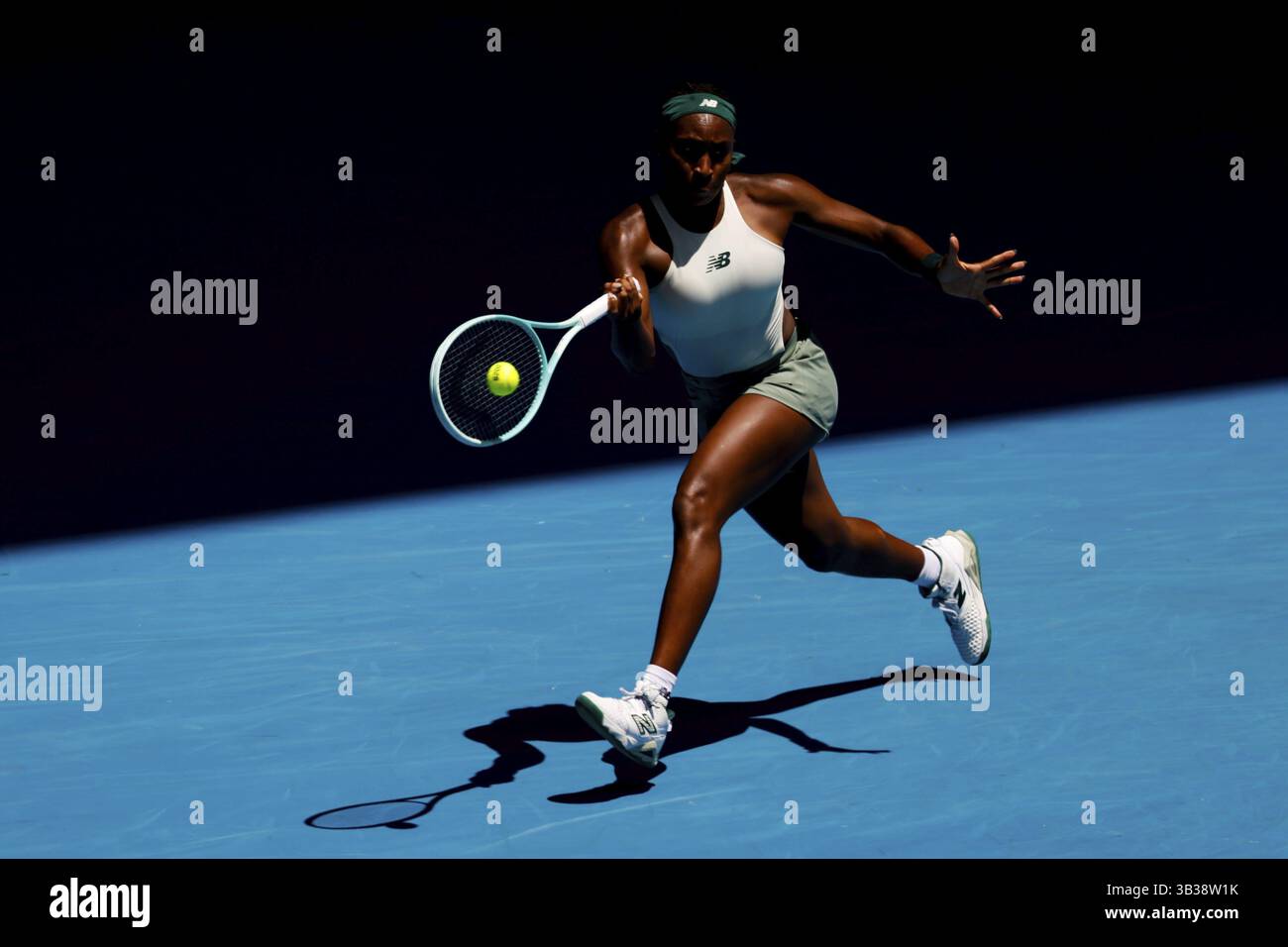 MELBOURNE, AUSTRALIA - JANUARY 19: Coco Gauff of USA hits a forehand to Belinda Bencic of ...