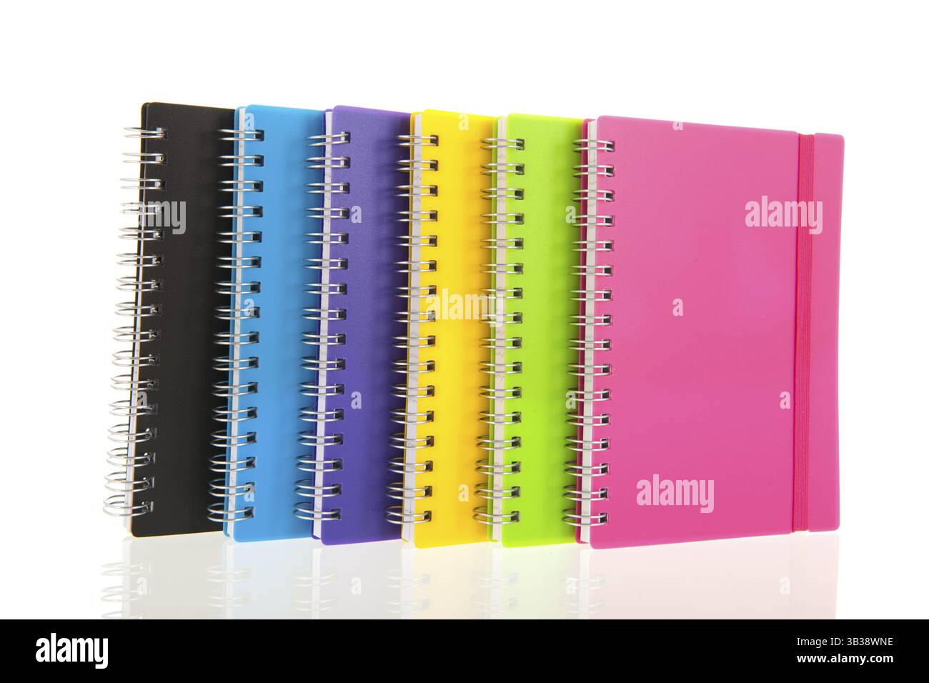 Stacked colorful notebooks isolated over white background Stock Photo ...