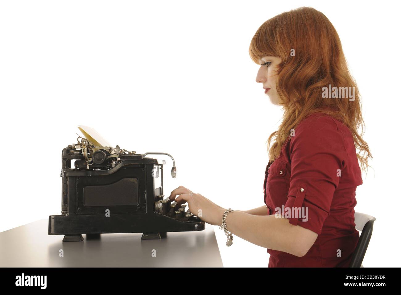 Woman at the office with very old black typewriter Stock Photo - Alamy