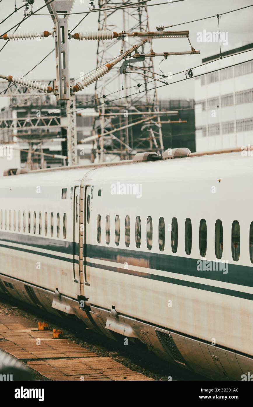KYOTO, JAPAN - SEPTEMBER 24 2024: A Shinkansen high-speed bullet train arriving at Kyoto Station ...