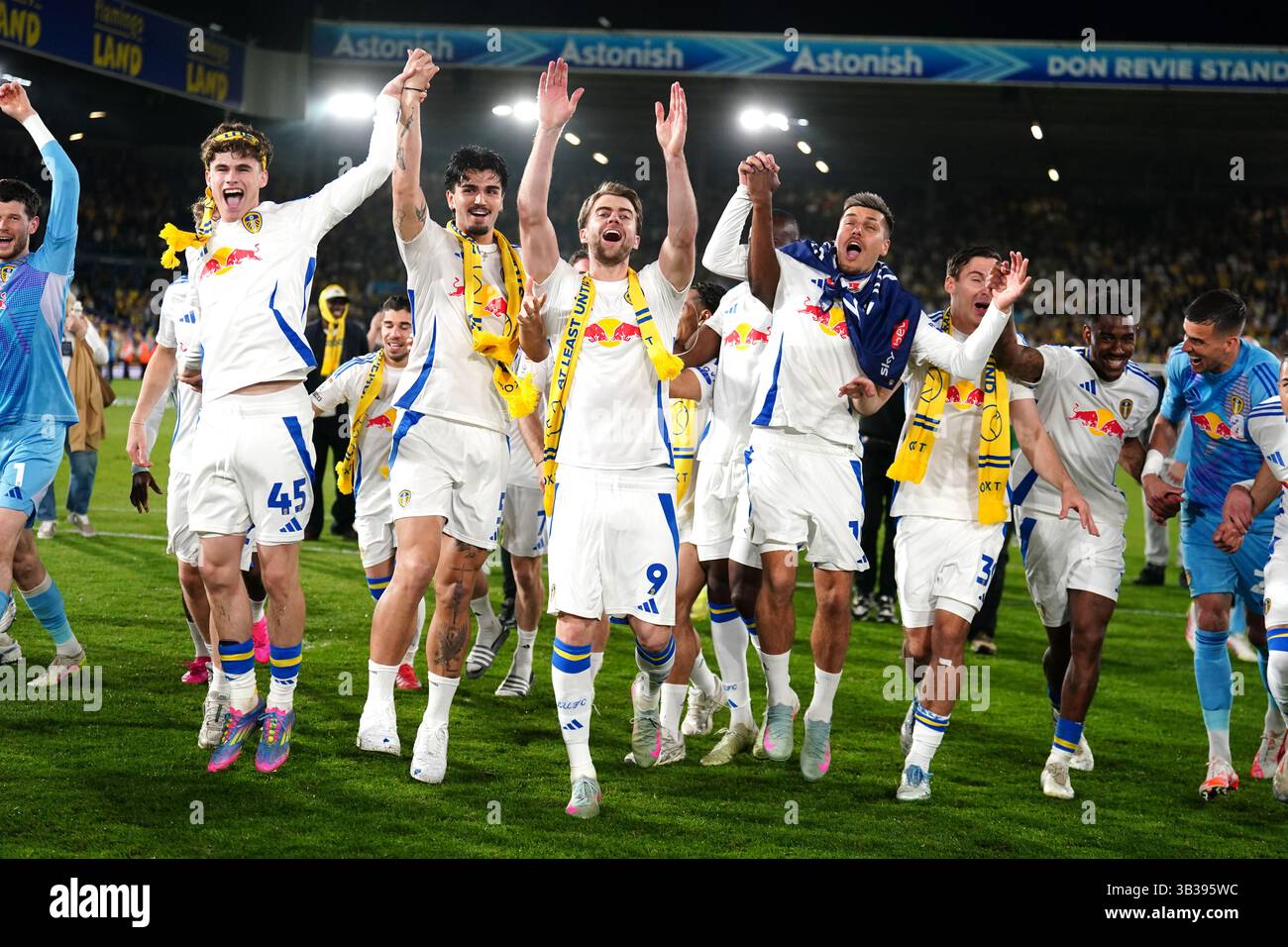 Leeds United players celebrate promotion to the Premier League with ...