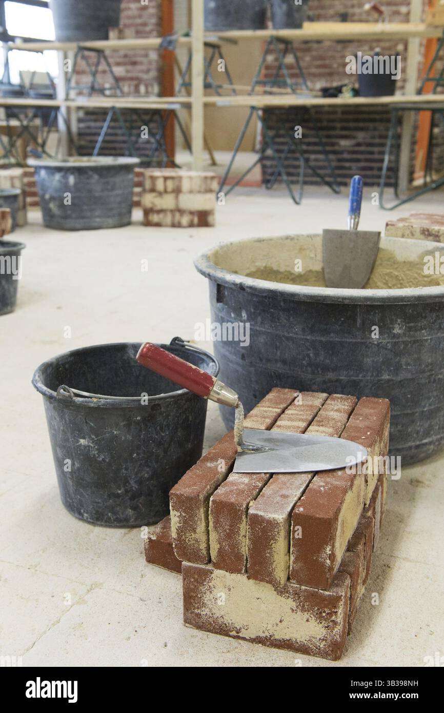 Trowel and bricks to build a house or a wall Stock Photo - Alamy