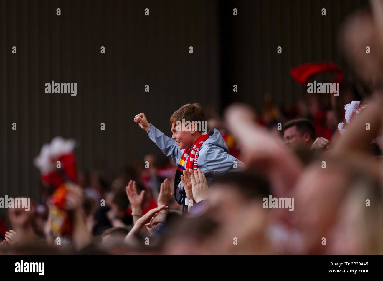 A young Liverpool fan celebrates during the Premier League match ...