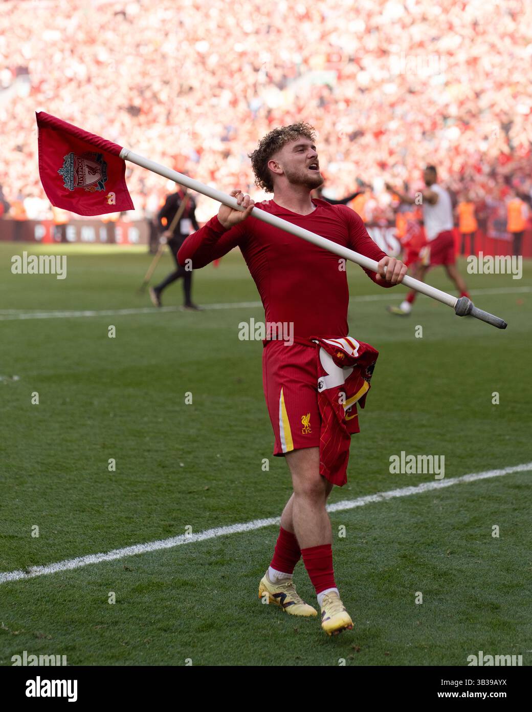Liverpool's Harvey Elliott celebrates in front of their fans during the ...