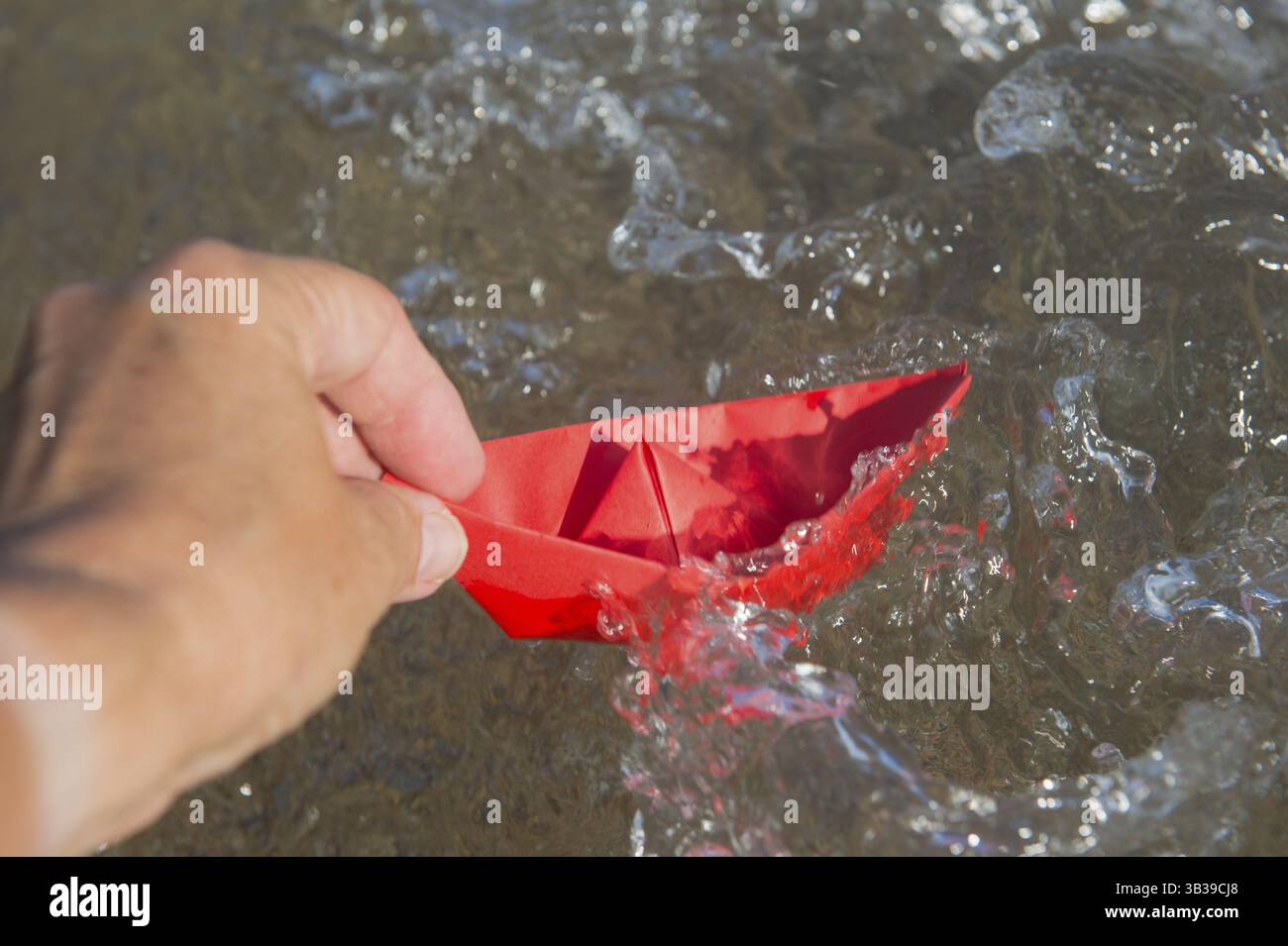 Origami color paper boats hi-res stock photography and images - Alamy