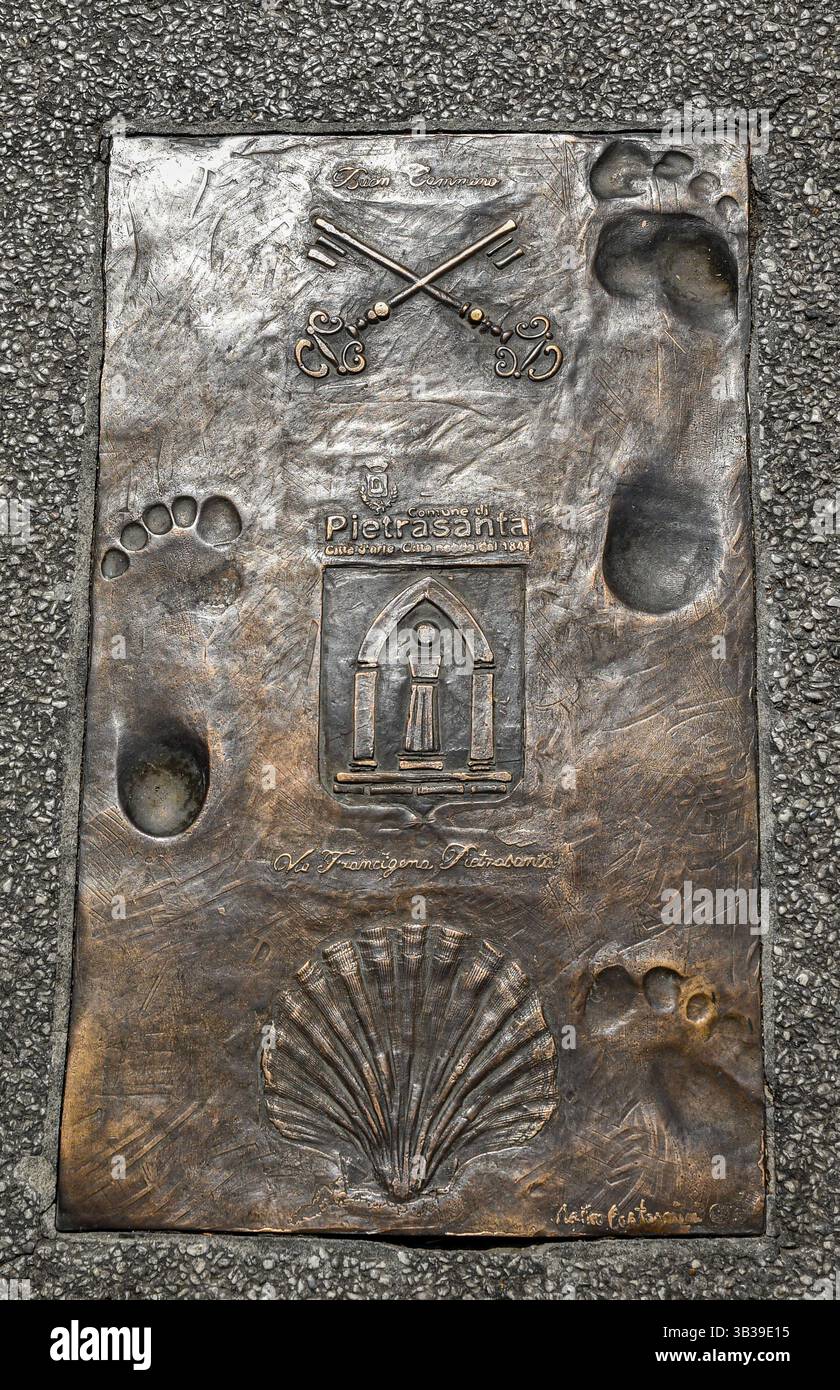 View from above of a bronze plaque depicting symbols of the Via ...