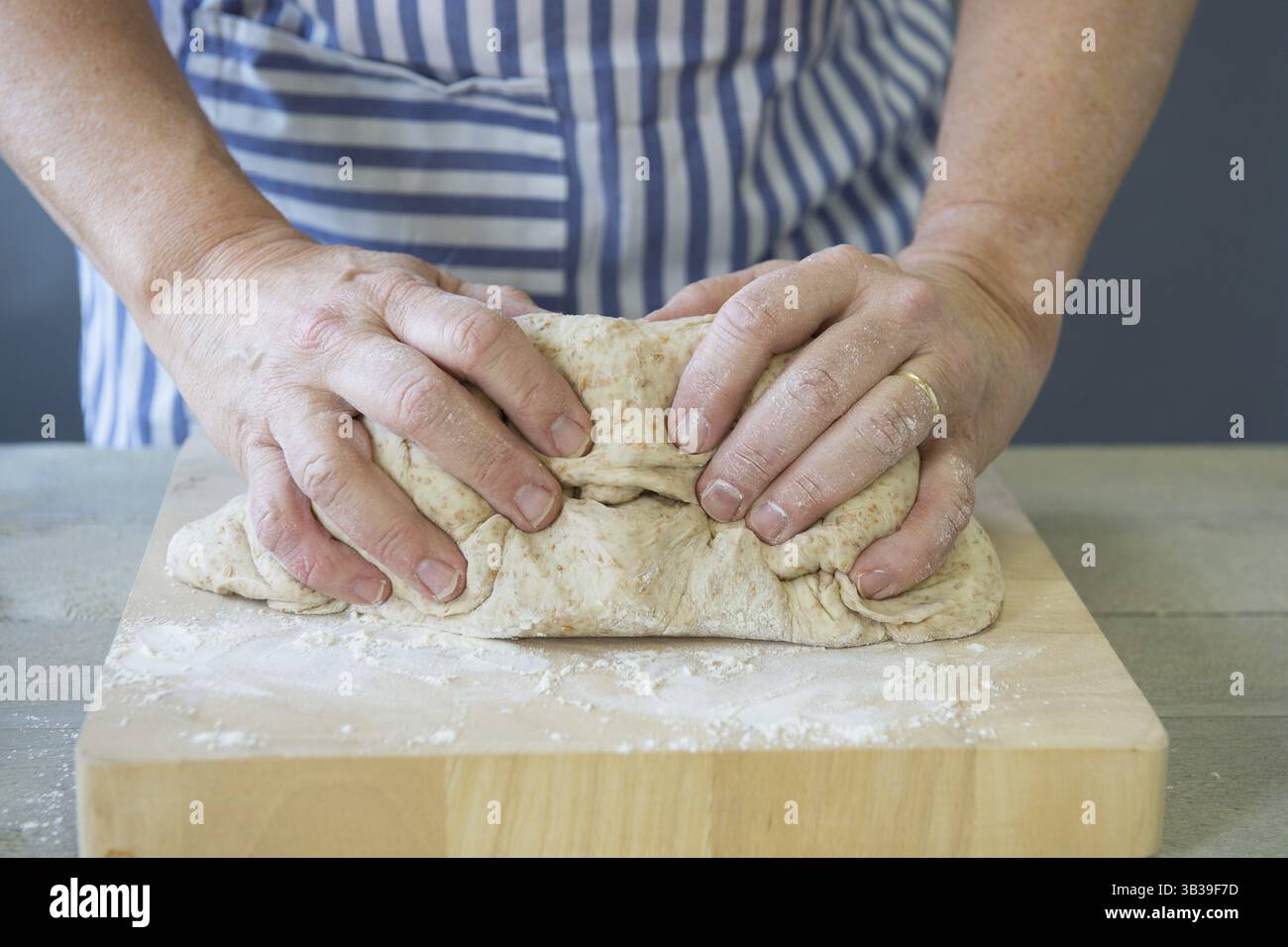 Female hands kneading bread hi-res stock photography and images - Alamy