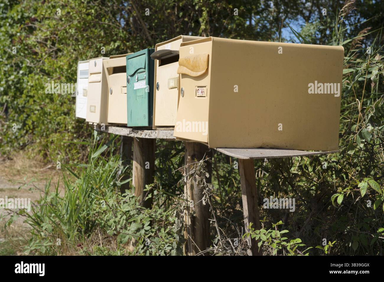 Many retro mail outdoor boxes in a row Stock Photo - Alamy