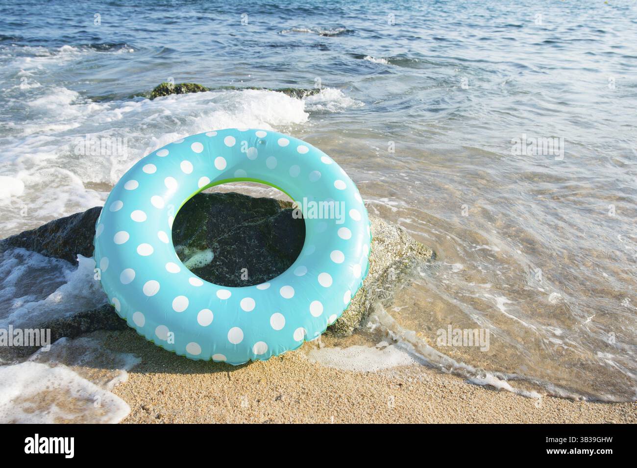 Landscape Spanish Costa Brava beach with inflatable toys Stock Photo ...