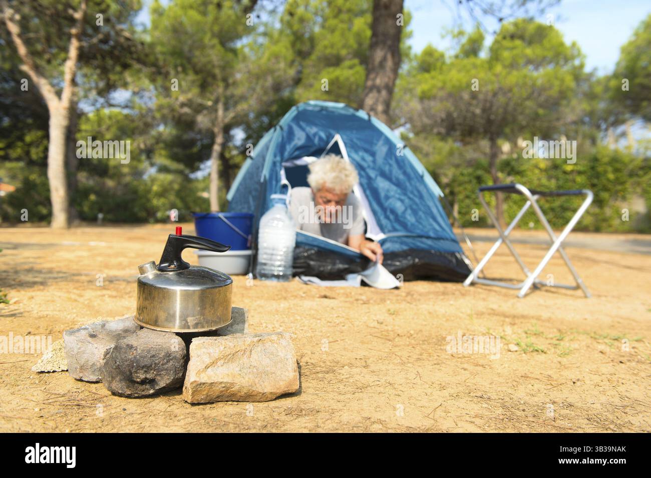 Man reading magazine camping hi-res stock photography and images - Alamy