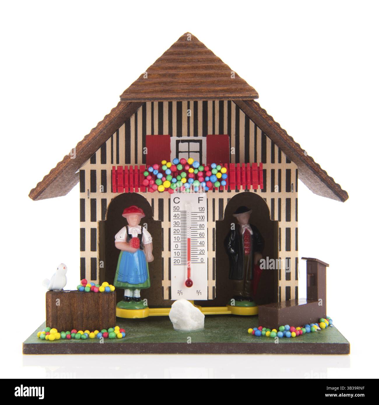 Miniature weather house with man and woman indoor and outdoor Stock ...