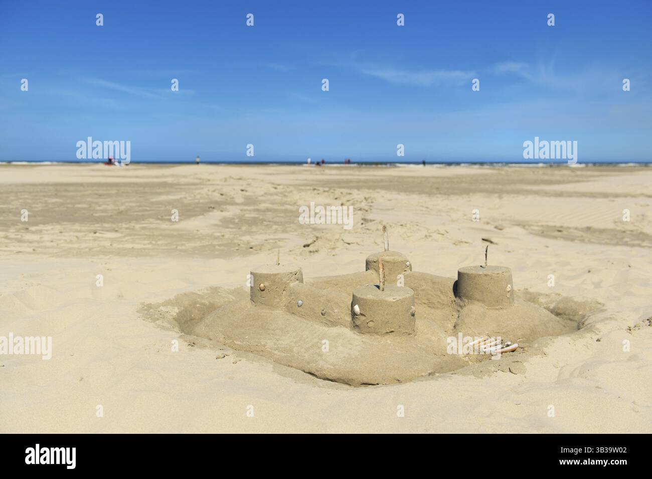 Sand castle with shells at the beach Stock Photo - Alamy