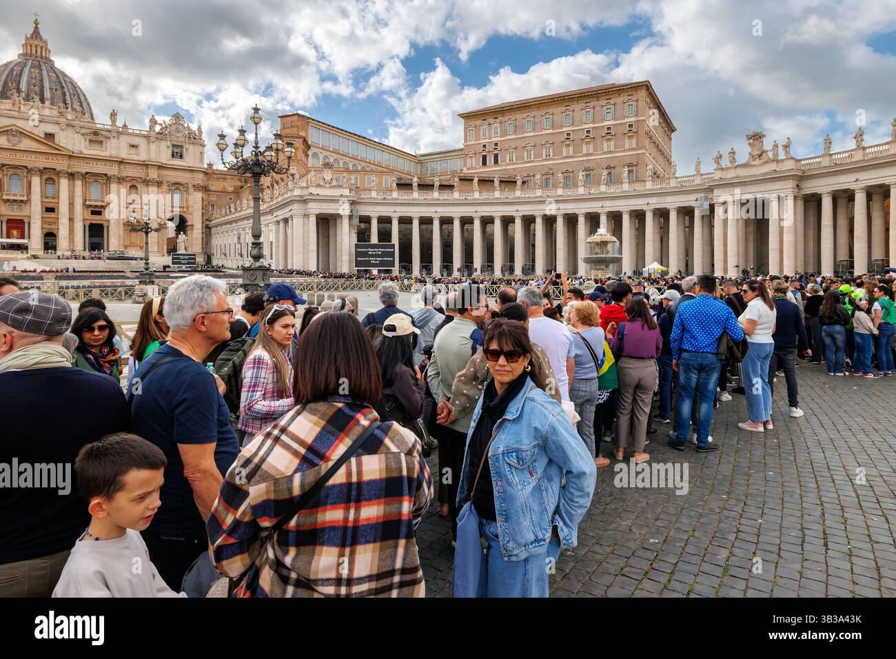 Vatican City, Vatican - April 25, 2025: Faithful line up to enter St ...
