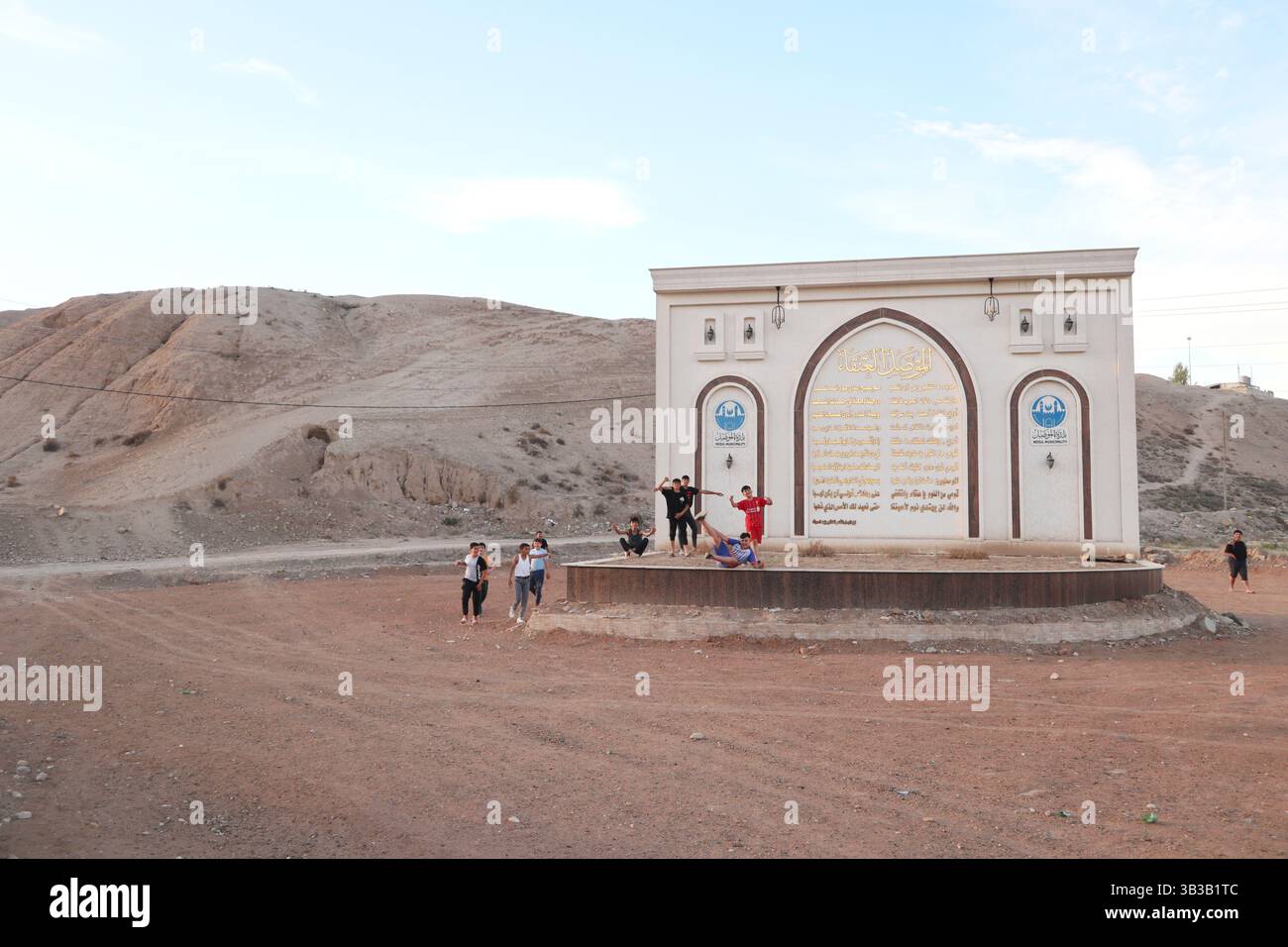 Mosul, Iraq. 27th Apr, 2025. Children play by Kuyunjik mound, the site ...