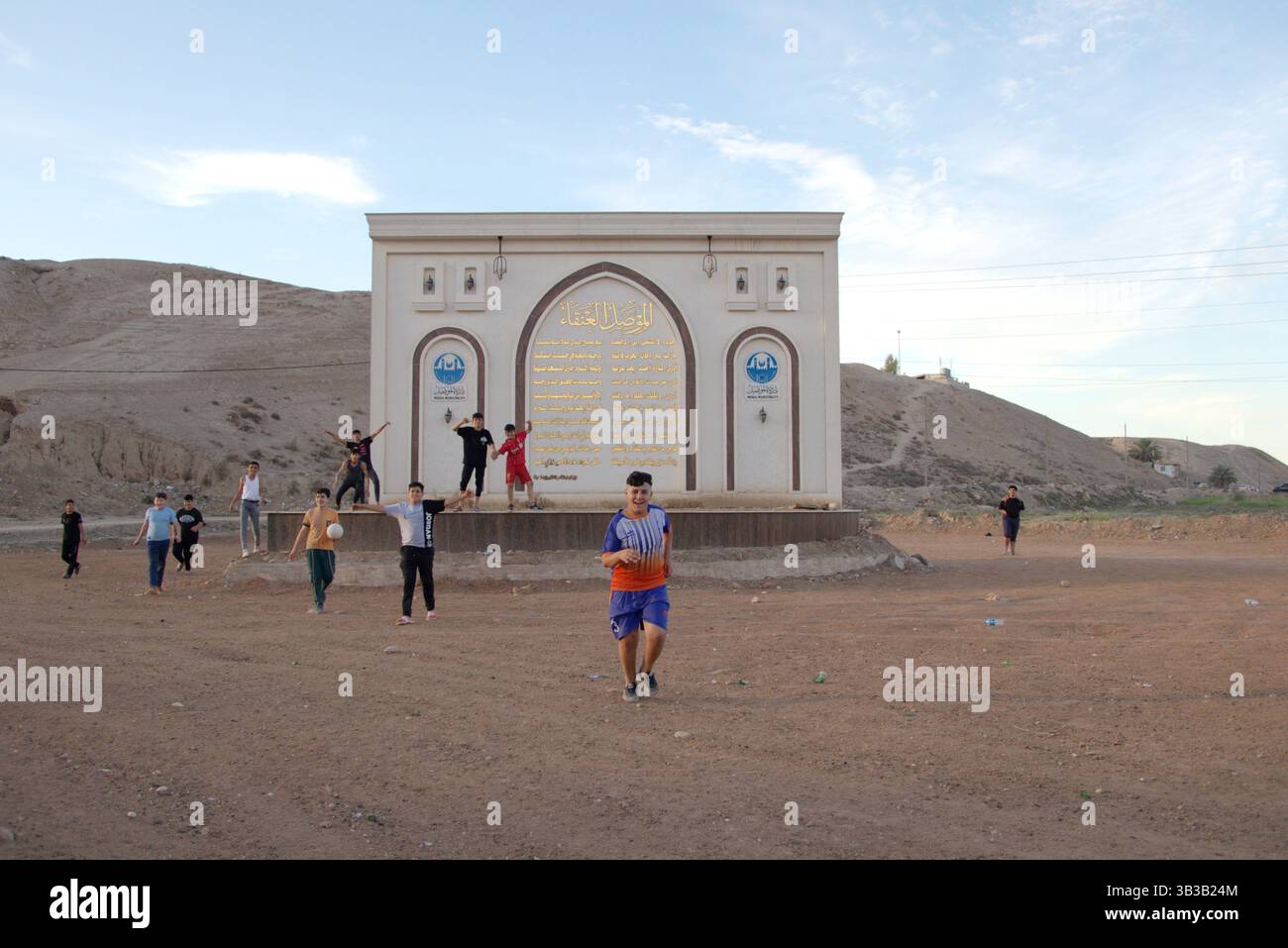 Mosul, Iraq. 27th Apr, 2025. Children play by Kuyunjik mound, the site ...