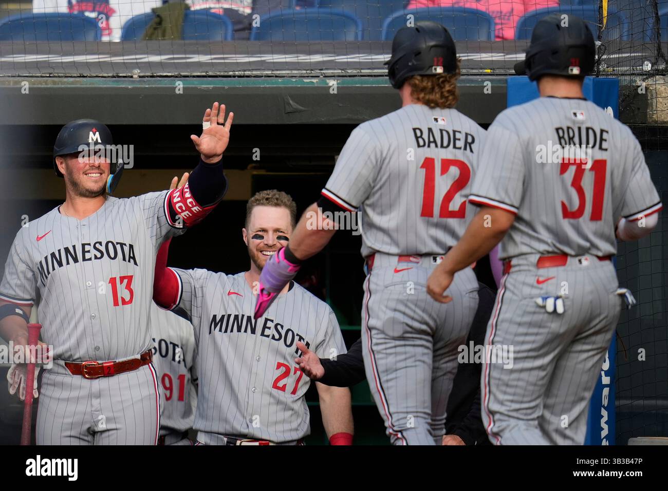 Minnesota Twins' Harrison Bader (12) and Jonah Bride (31) are greeted ...