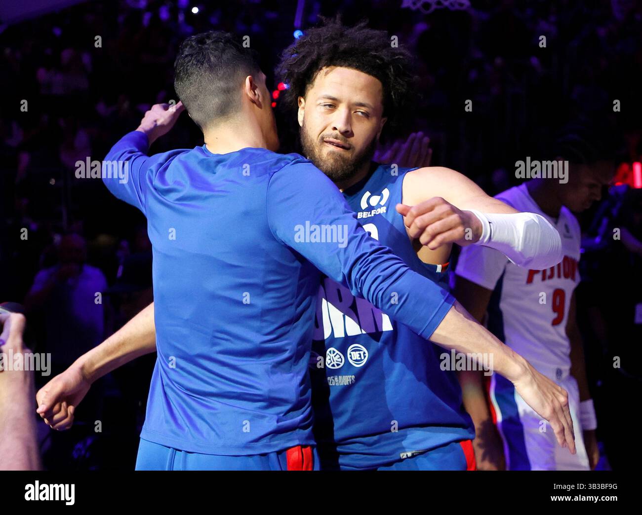 Detroit Pistons guard Cade Cunningham, right, embraces Simone Fontecchio while being introduced ...