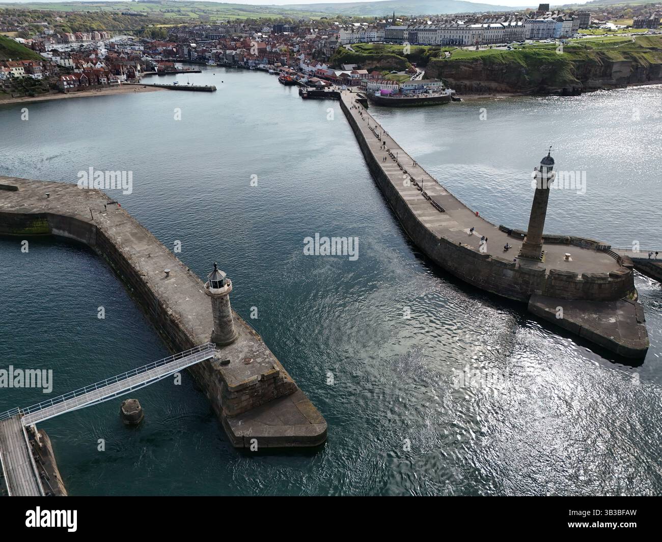 Aerial view of Whitby, seaside resort and fishing port sea wall on the ...