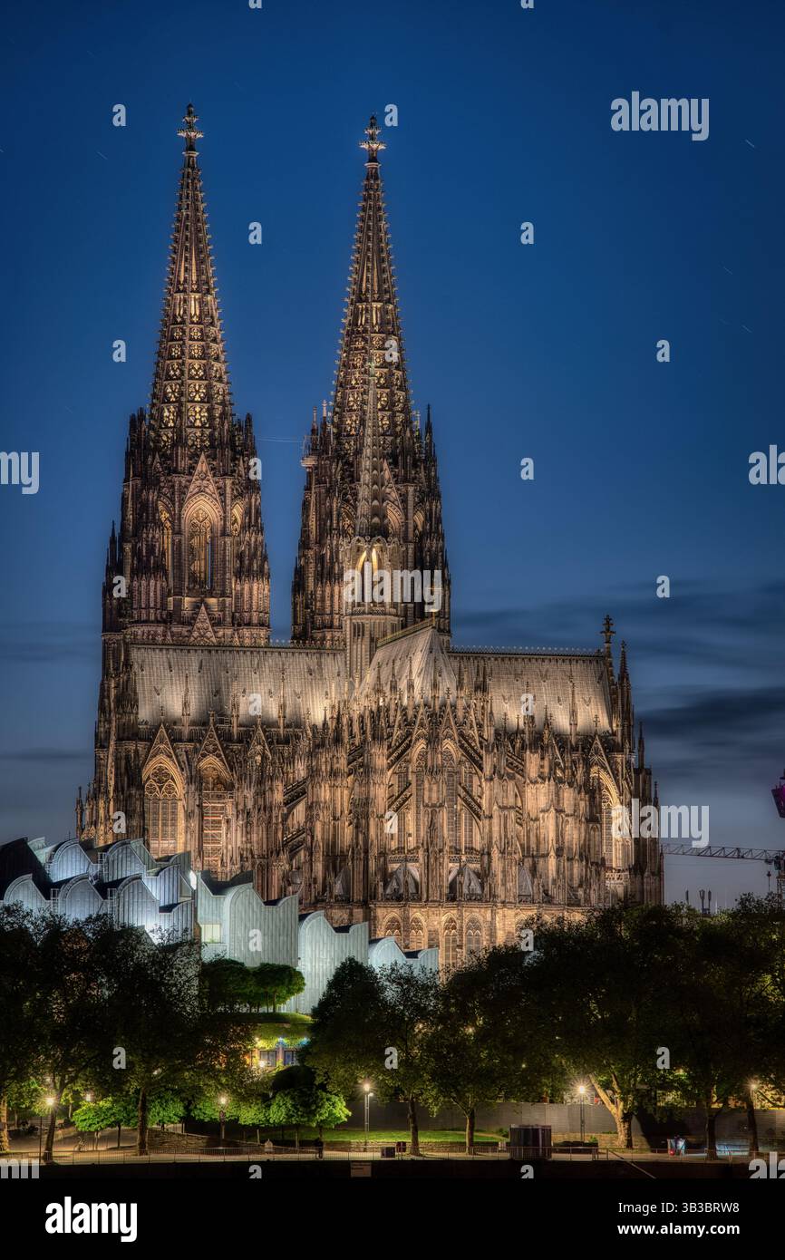 the majestic Cologne cathedral in the blue hour illuminated by the ...
