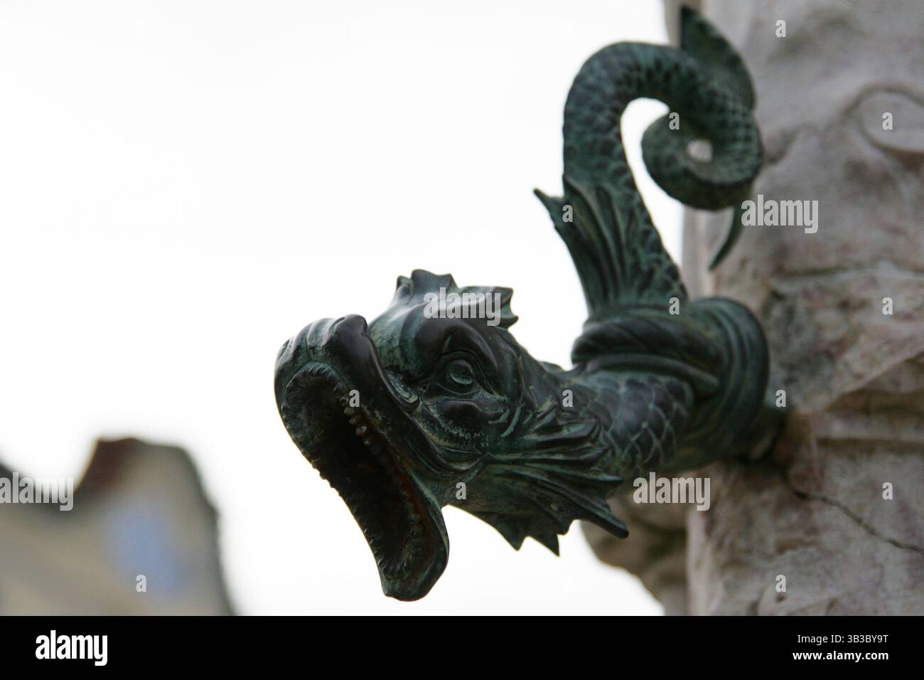 Dragon head on a column in the old town of Lisbon Stock Photo - Alamy