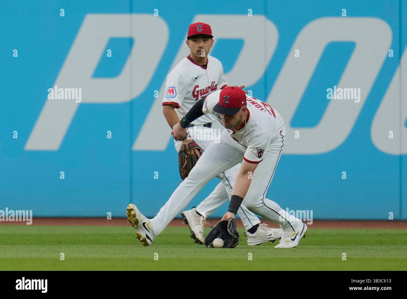Cleveland Guardians center fielder Nolan Jones (22) fields a ground ...