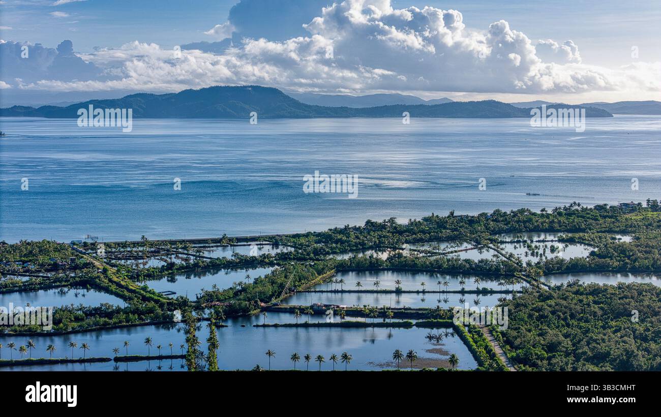 Surigao City, Philippines. Looking across the shrimp farms of Sabang ...
