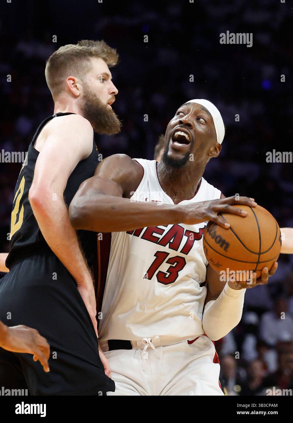 Cleveland Cavaliers forward Dean Wade, left, defends against Miami Heat ...