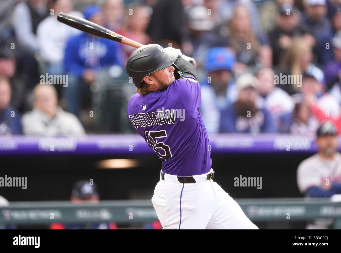 Colorado Rockies' Hunter Goodman follows the flight of his three-run ...