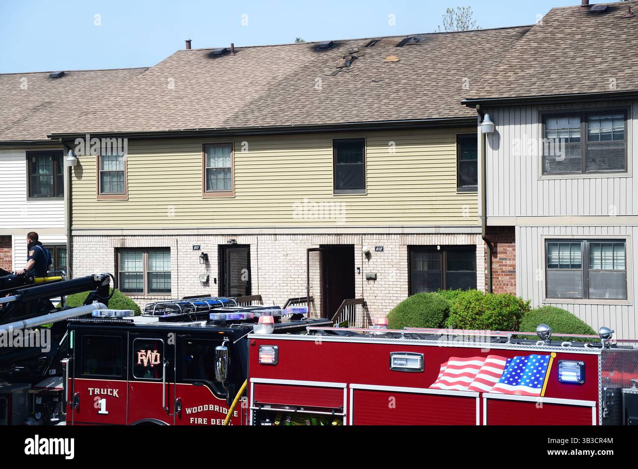 RACE: A house fire threatens to spread to that of neighboring homes as ...