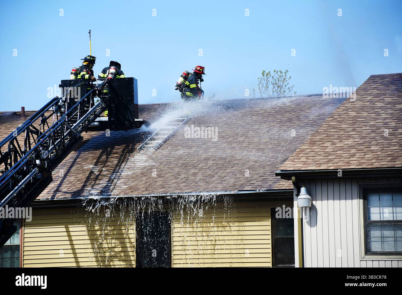 RACE: A house fire threatens to spread to that of neighboring homes as ...