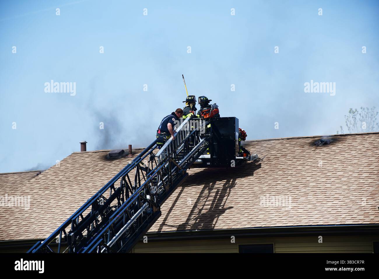 RACE: A house fire threatens to spread to that of neighboring homes as ...