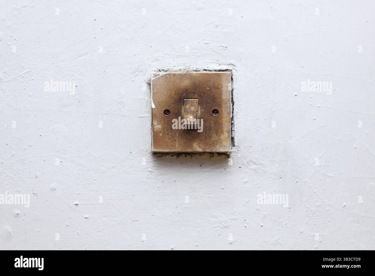 old light switch mounted on white wall Stock Photo - Alamy