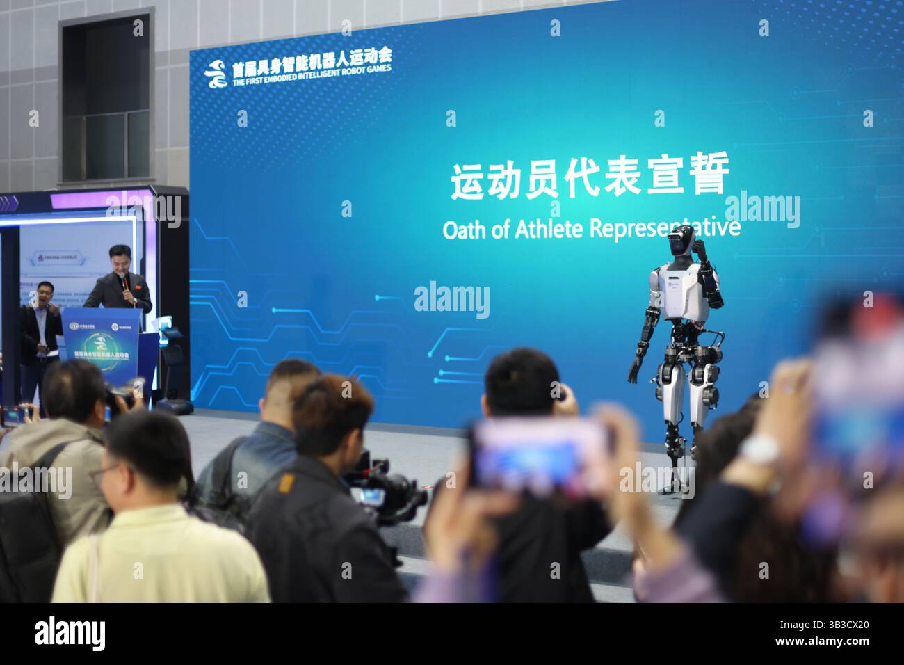 A robot takes an oath at the opening ceremony of the First Embodied ...