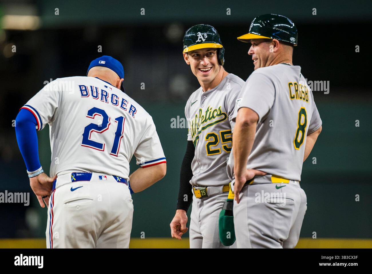Athletics' Brent Rooker (25) talks with first base coach Bobby ...