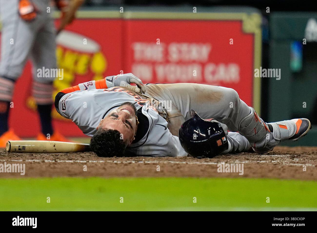 Detroit Tigers' Javier Báez is reacts after fouling a pitch off his leg ...