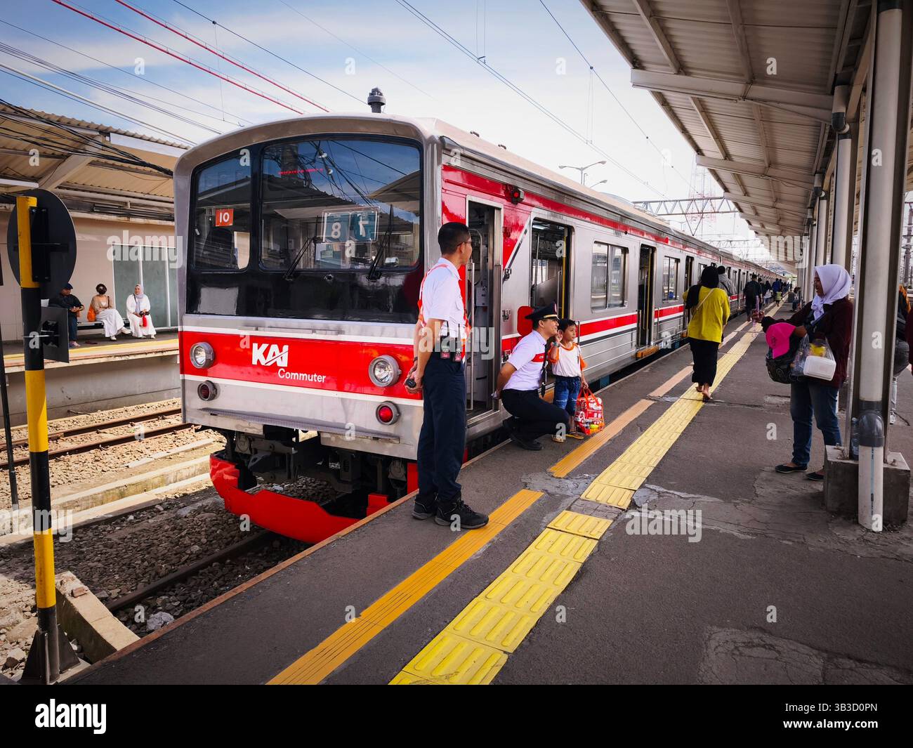 A mother takes a picture of her child who wants to be photographed with ...