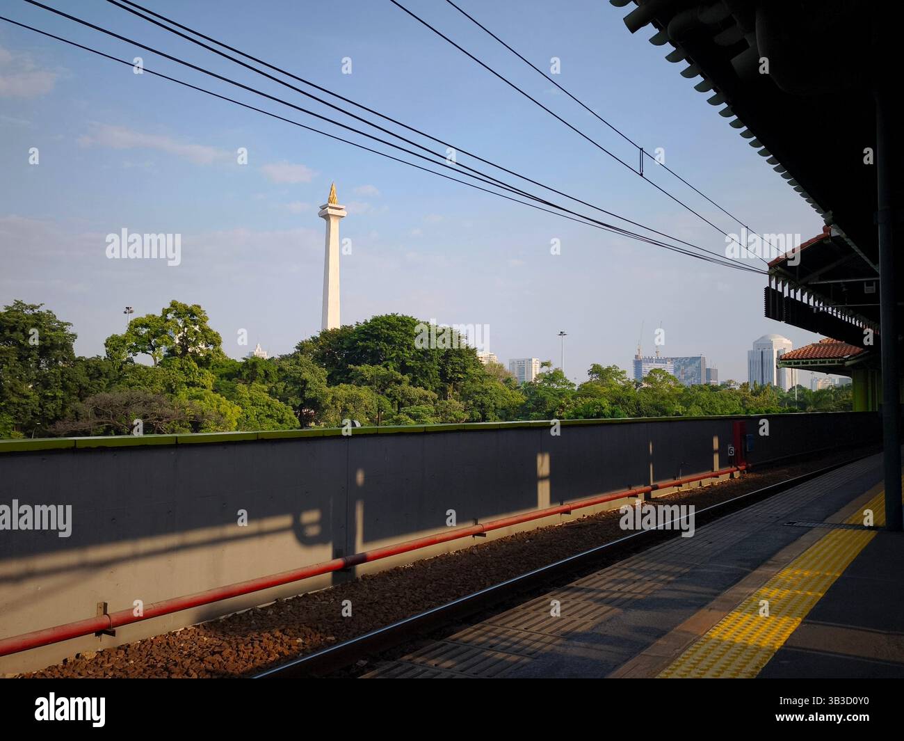 The towering National Monument building seen from Gambir Train Station ...