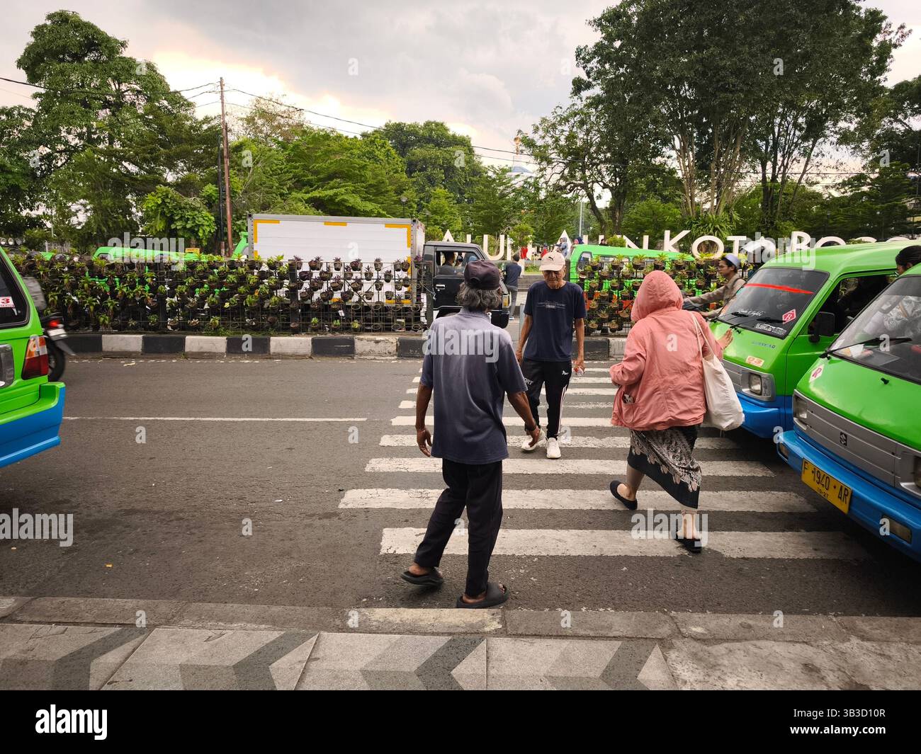 Pedestrians are crossing the road through the Zebracross sign Stock ...