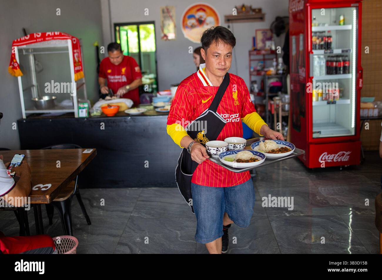 Lamphun, Thailand. 28th Apr, 2025. A chicken rice restaurant employee ...