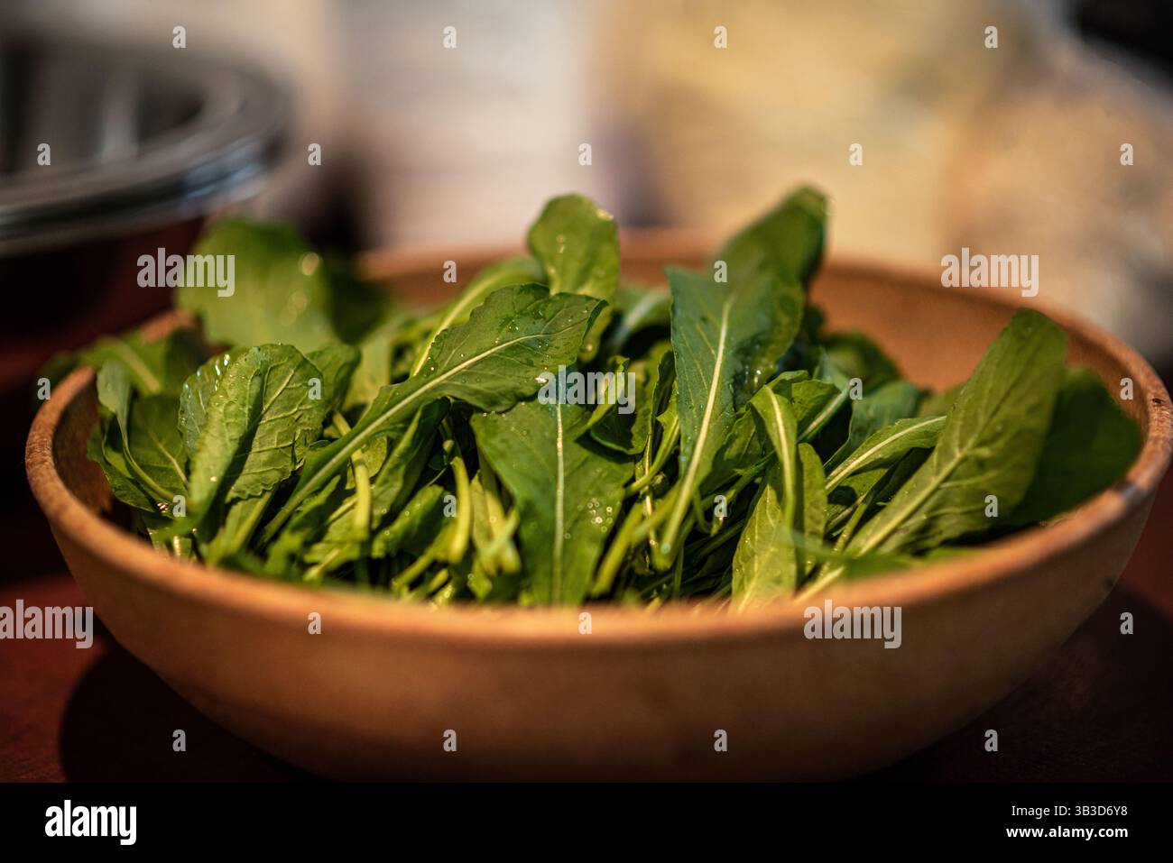 Fresh arugula in bowl hi-res stock photography and images - Alamy