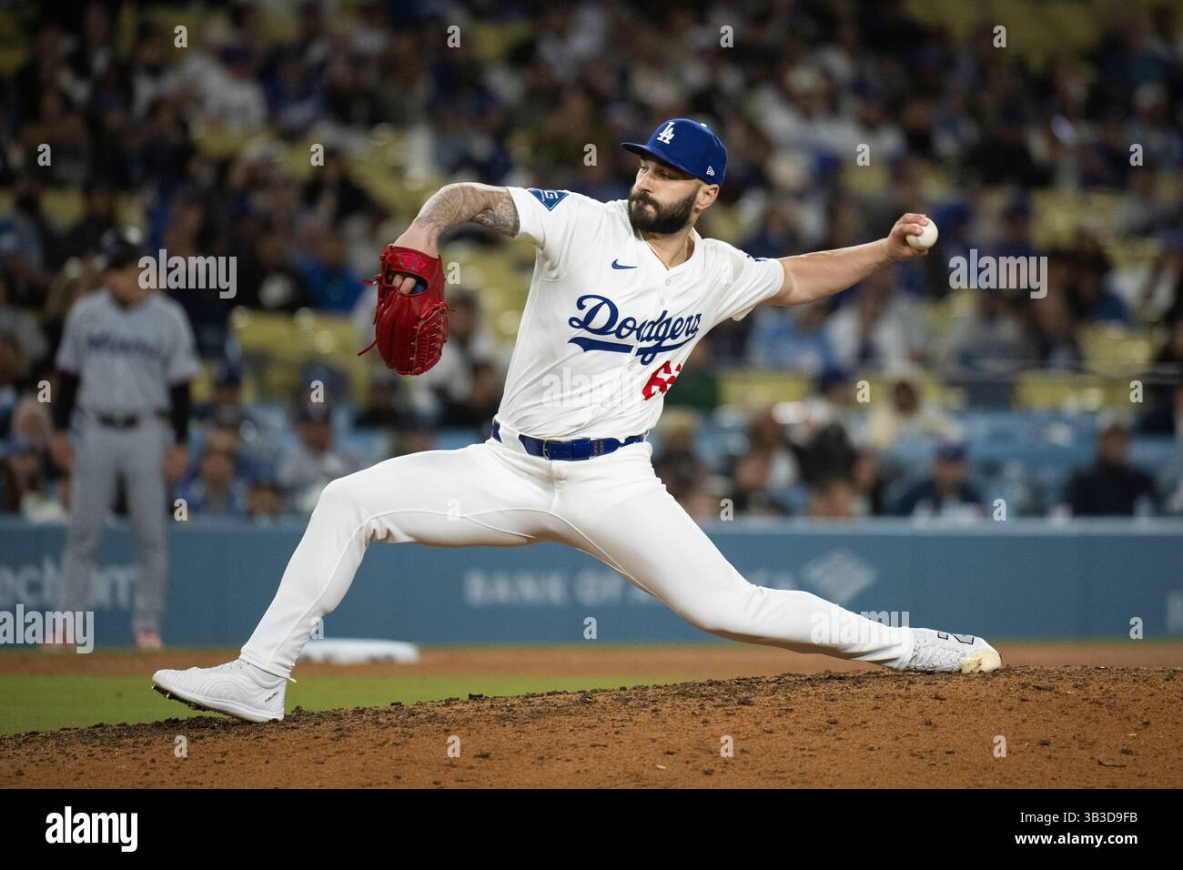 Los Angeles Dodgers relief pitcher Tanner Scott delivers a pitch during ...
