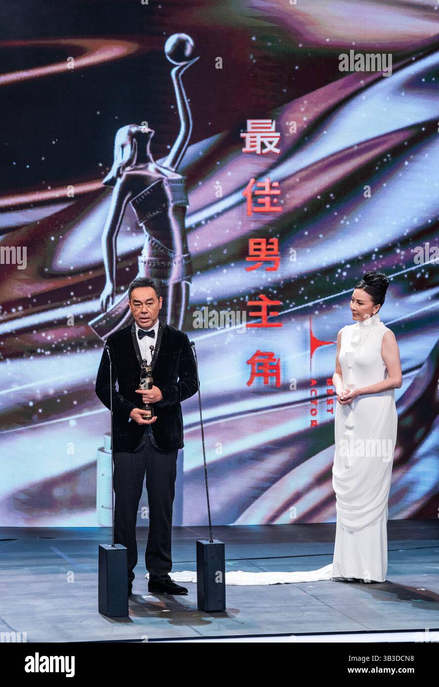 Actor Sean Andy (L) is awarded the Best Actor for her role in the film ...