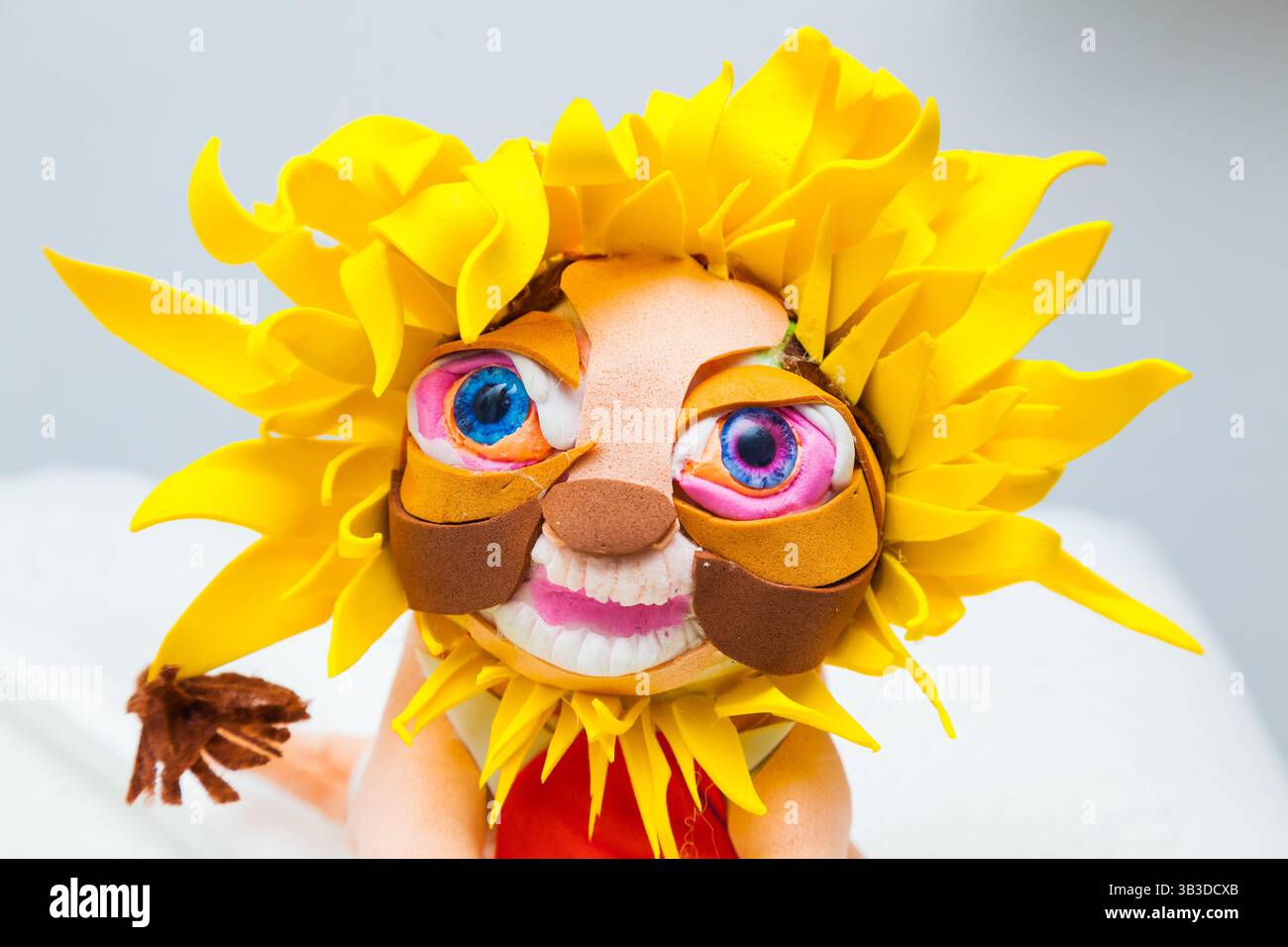 Handmade doll in the form of a sunflower, close-up. Handmade doll in ...