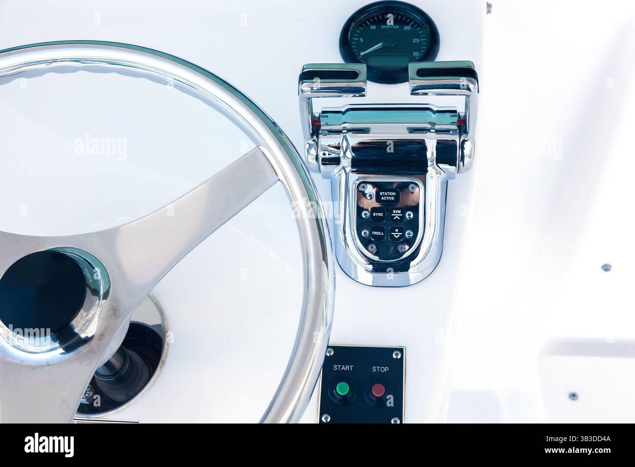 Motor yacht control panel. Steering wheel, gear levers, control button ...