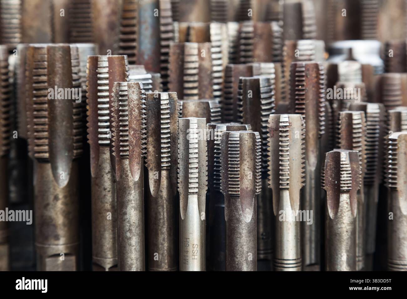 Multiple thread taps in different sizes, front view. Threading tool ...