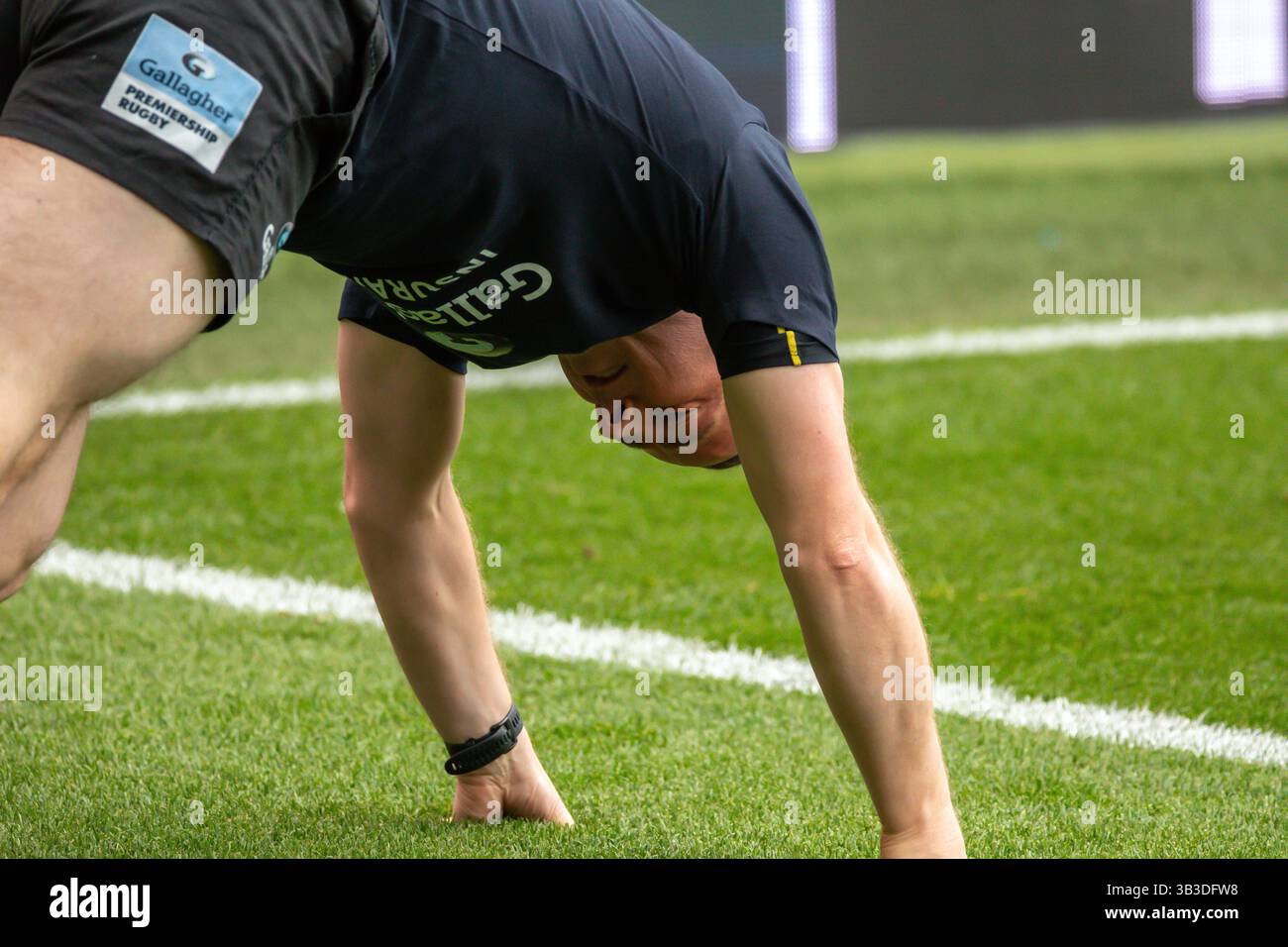 Northampton, UK, 26th April 2025 Referee Adam Leal stretches and warms ...