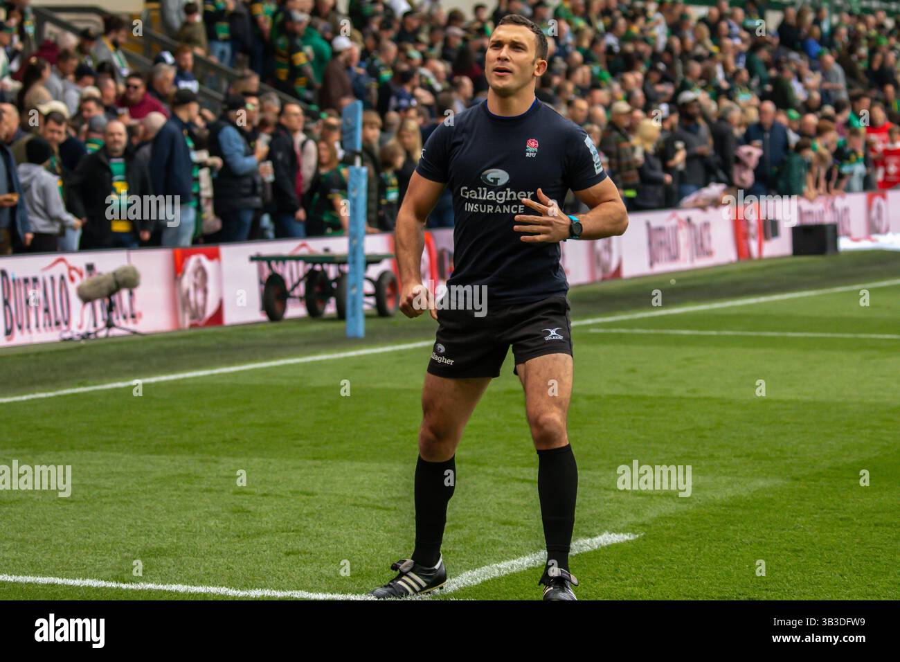 Northampton, UK, 26th April 2025 Referee Adam Leal stretches and warms ...