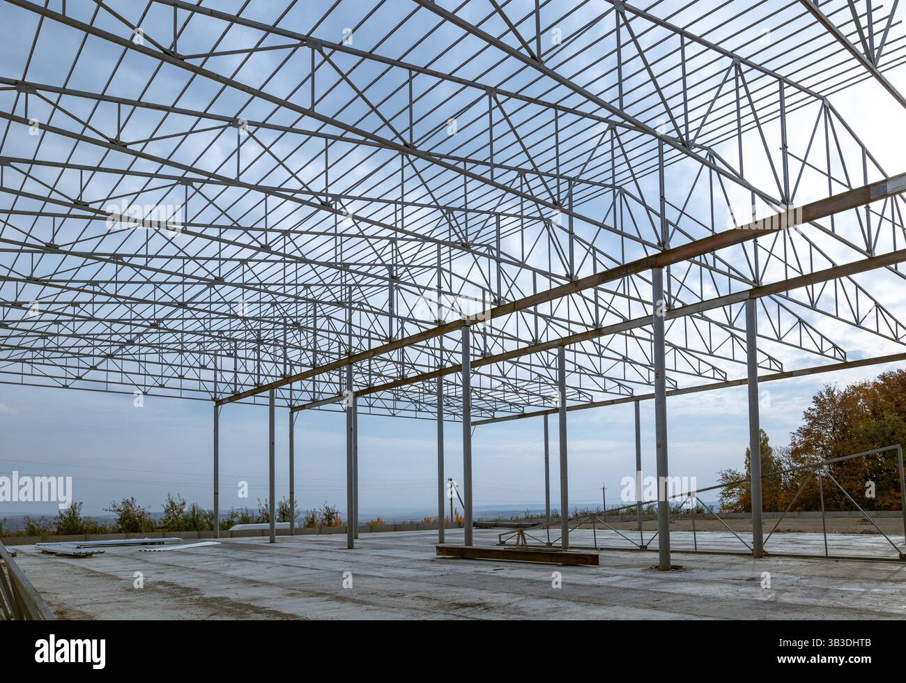 Installation of a steel frame under the sip panels of a warehouse with ...