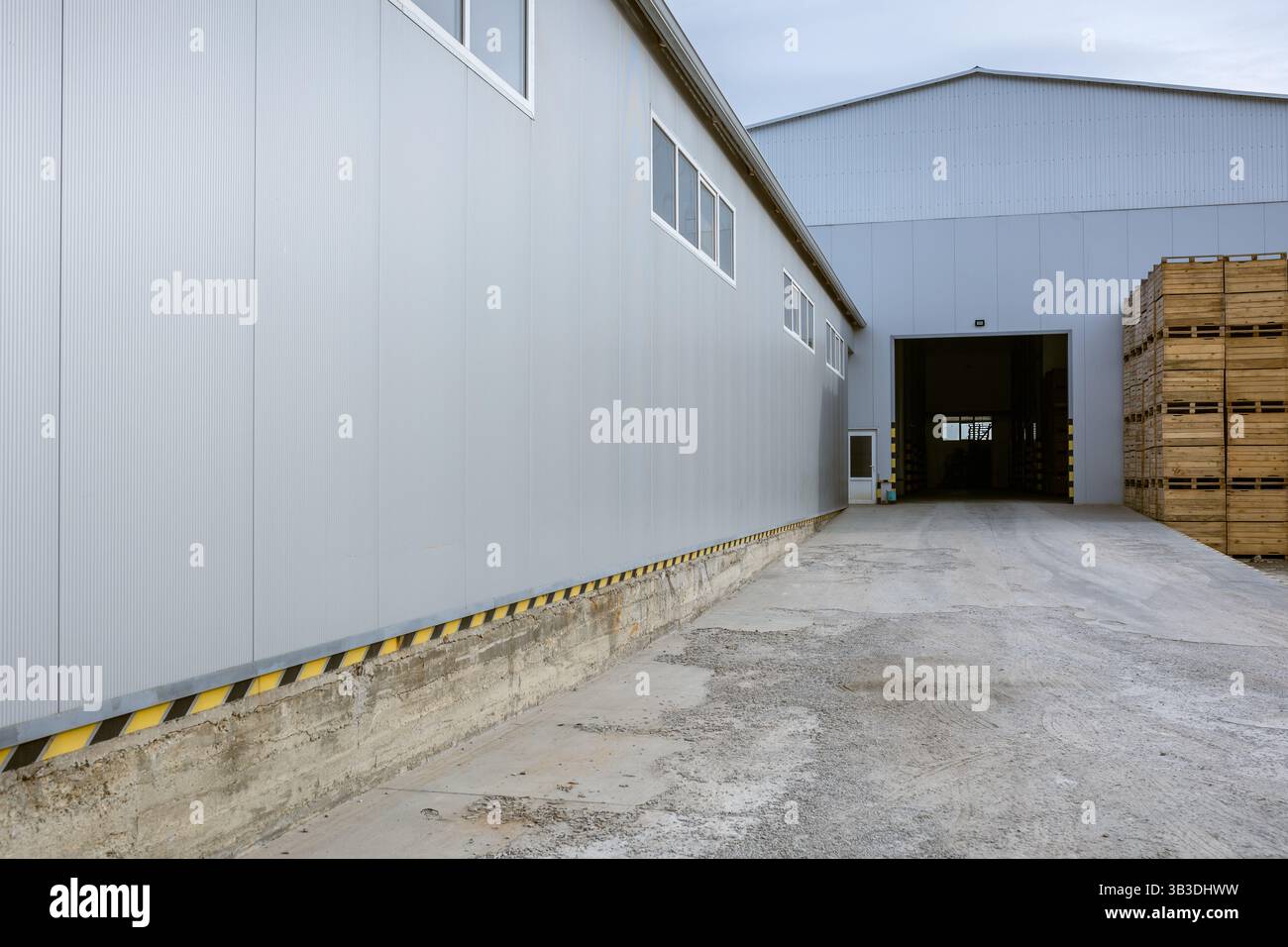 Cargo terminal of the logistics center. Stacked up empty pallets boxes ...