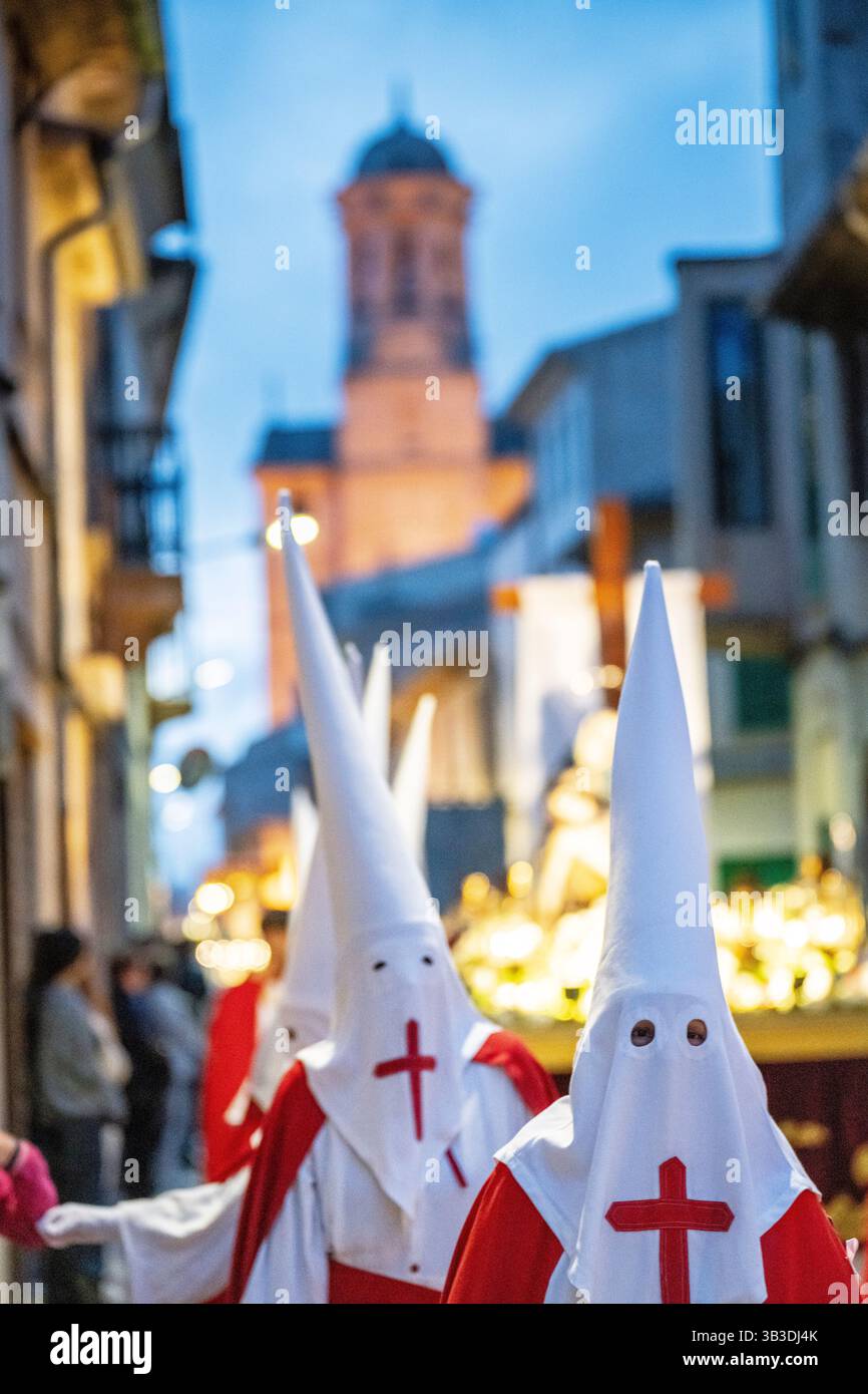Hooded brothers with conical hats that serve as masks, Holy Week ...